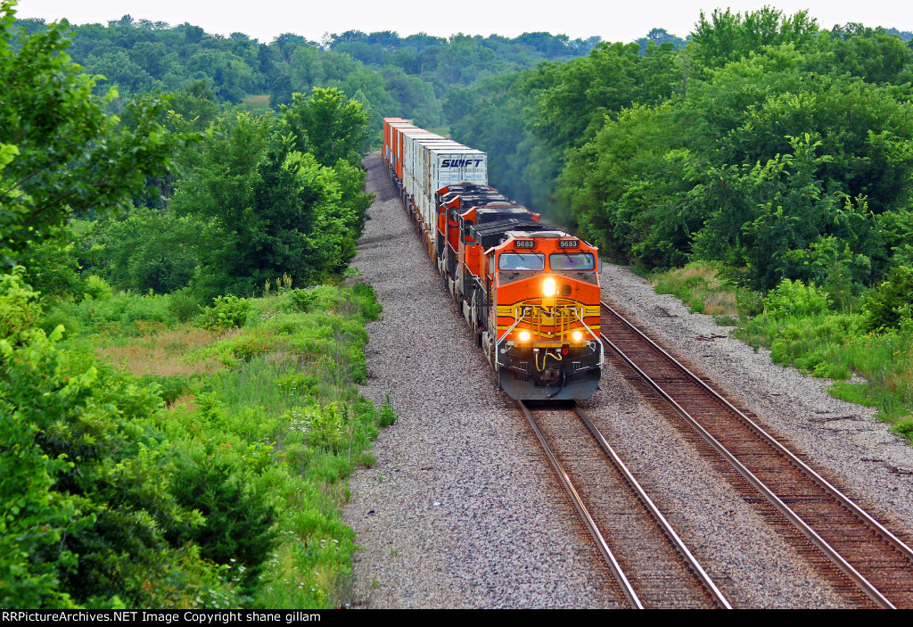 BNSF 5663 Leads a Short and over powerd Z train EB.